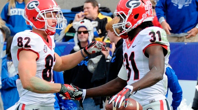 A dozen football players graduate Friday