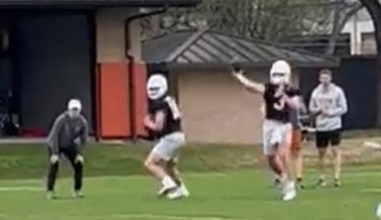 Quinn Ewers and Arch Manning throw passes alongside each other as ...