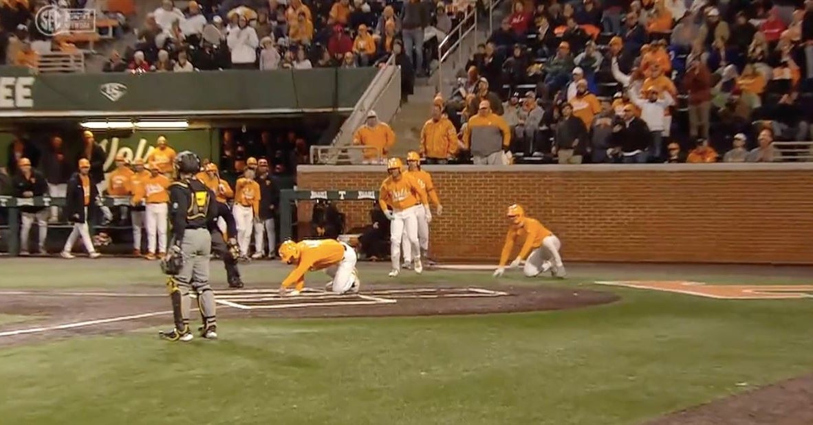 Tony Vitello reacts to Luc Lipcius touching home plate with one finger