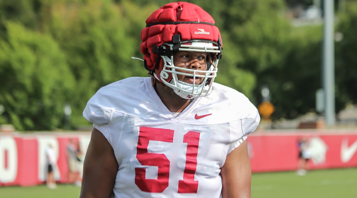 USC football offers massive Arkansas offensive tackle transfer Devon Manuel