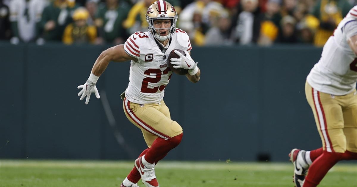 Christian McCaffrey's gift to a 49ers fan holding a sign saying he beat ...