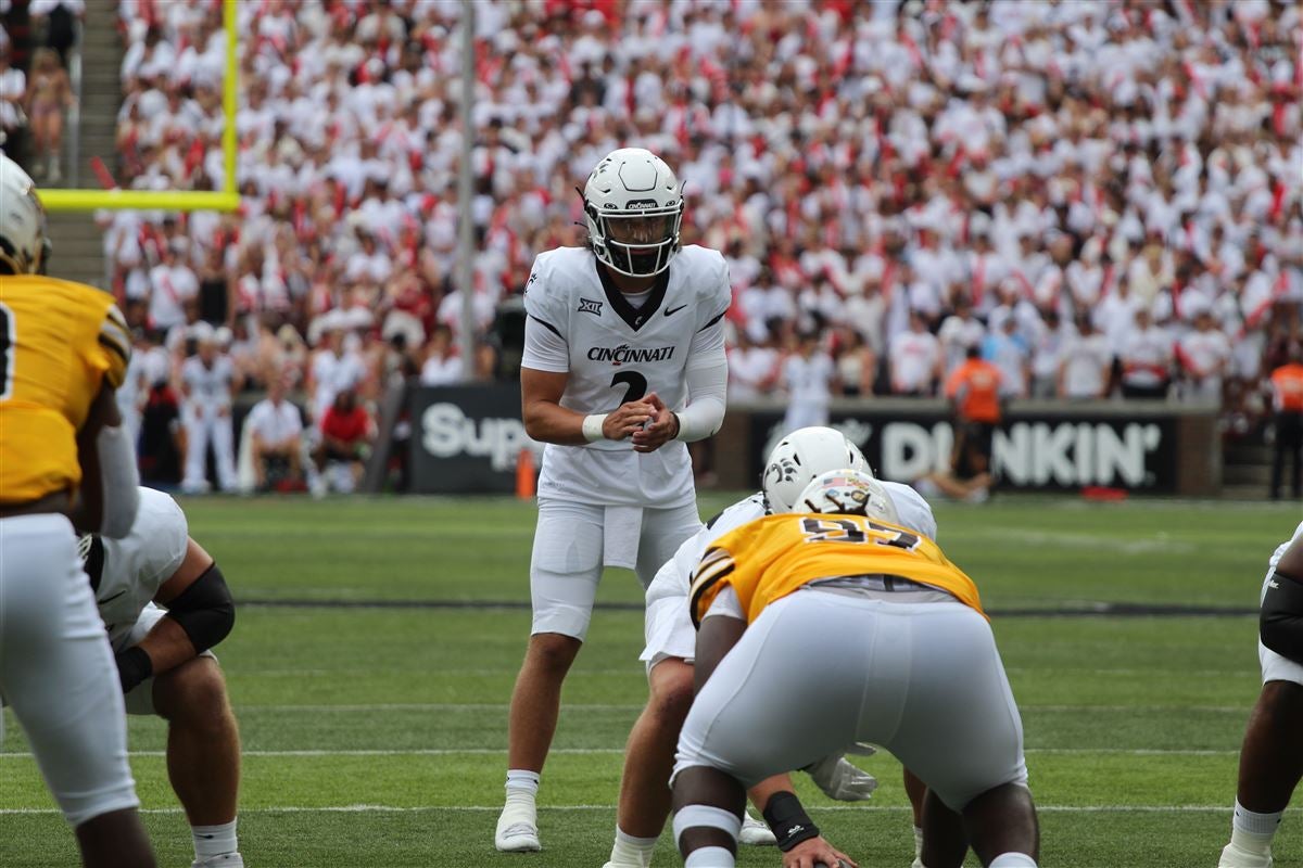 UC marches through opener, downs Towson 38-20