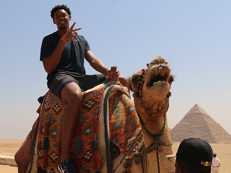 This photo of Austin Wiley riding a camel is everything