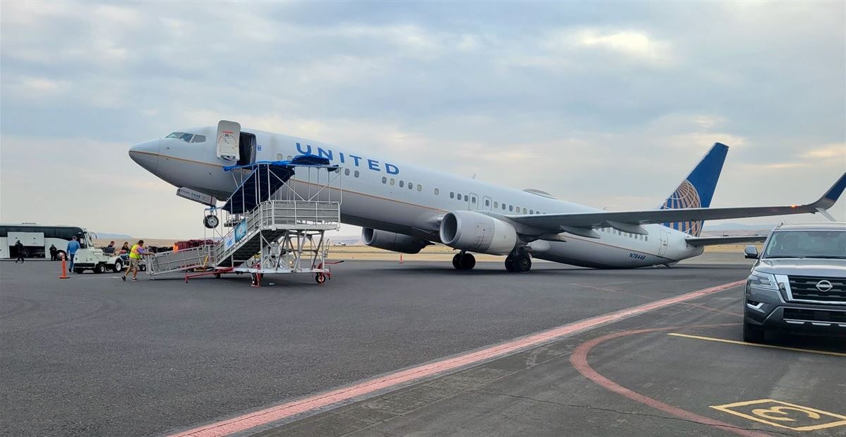 LOOK: USC football's plane pops a wheelie with team members still inside