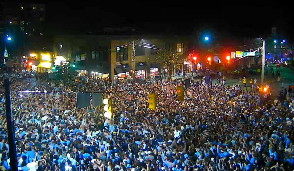WATCH: UNC Students & Fans Rush Franklin Street After Upset Win Over Duke