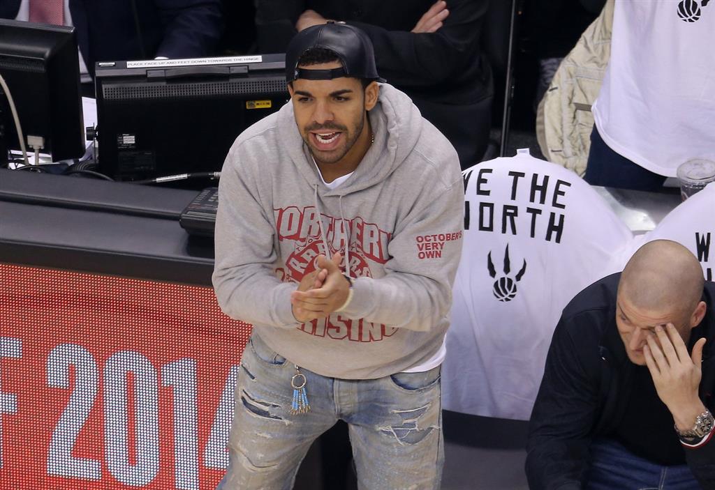 Drake goes crazy after a Toronto Raptors dunk