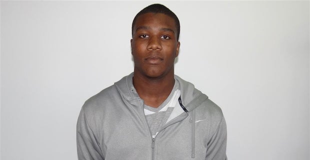 Carl Tucker and Anthony Ratliff sign financial aid agreements