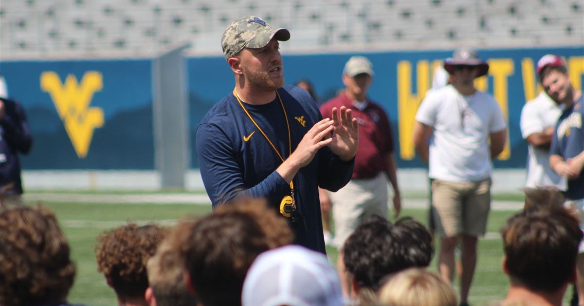Rich Rodriguez cleaning house, keeping one assistant and one support ...