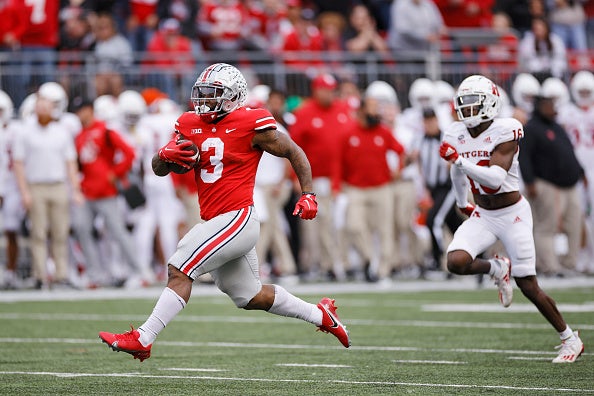 Joey Galloway gives Ohio State RB Miyan Williams a helmet sticker for ...