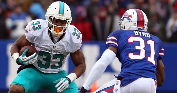 Dolphins Release Thomas, Thigpen