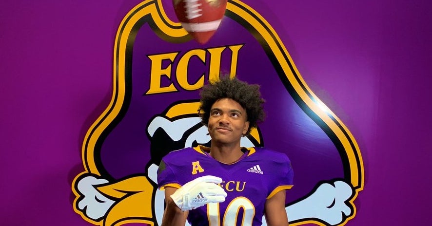 Brown bonds with ECU's staff during recent visit