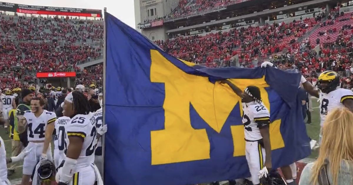 Michigan football players plant flag on Ohio State midfield logo after ...