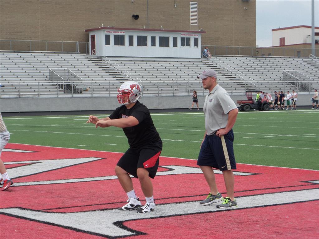 Matt Morgan, Chris Jacobson and Joe Villani tutor youths at camp