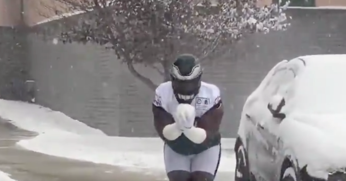 Tim Jernigan plays in snow at snowy NovaCare Complex