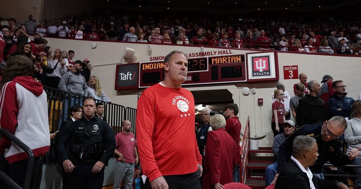 Pat Knight kisses the Assembly Hall floor in an emotional introduction ...
