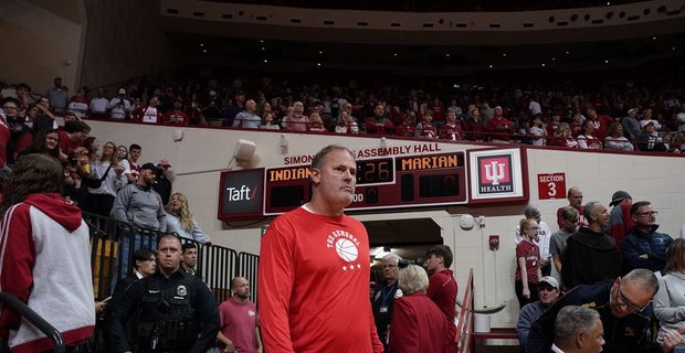 Pat Knight kisses the Assembly Hall floor in an emotional introduction ...