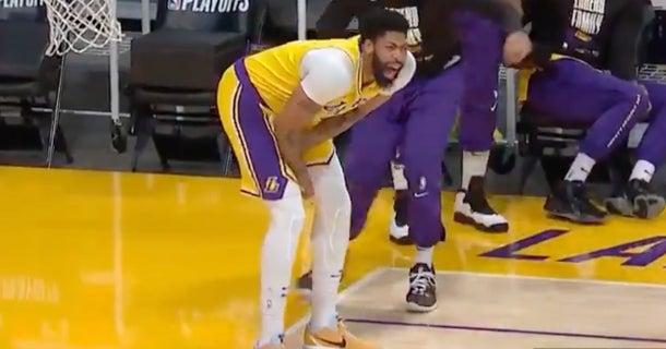WATCH: Anthony Davis heads to locker room after going down with injury