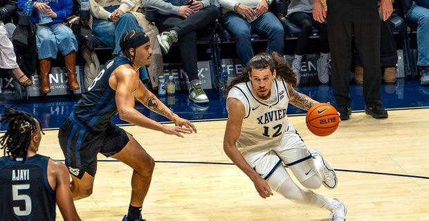 Tre Carroll's 29 points lead Xavier to 89-75 win over Butler