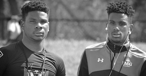 For Quinton: Moore twins play to honor late brother