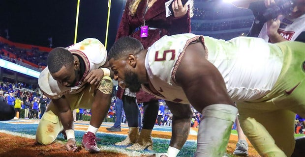 Photo Gallery: Postgame celebration as the Seminoles raise the Gator ...