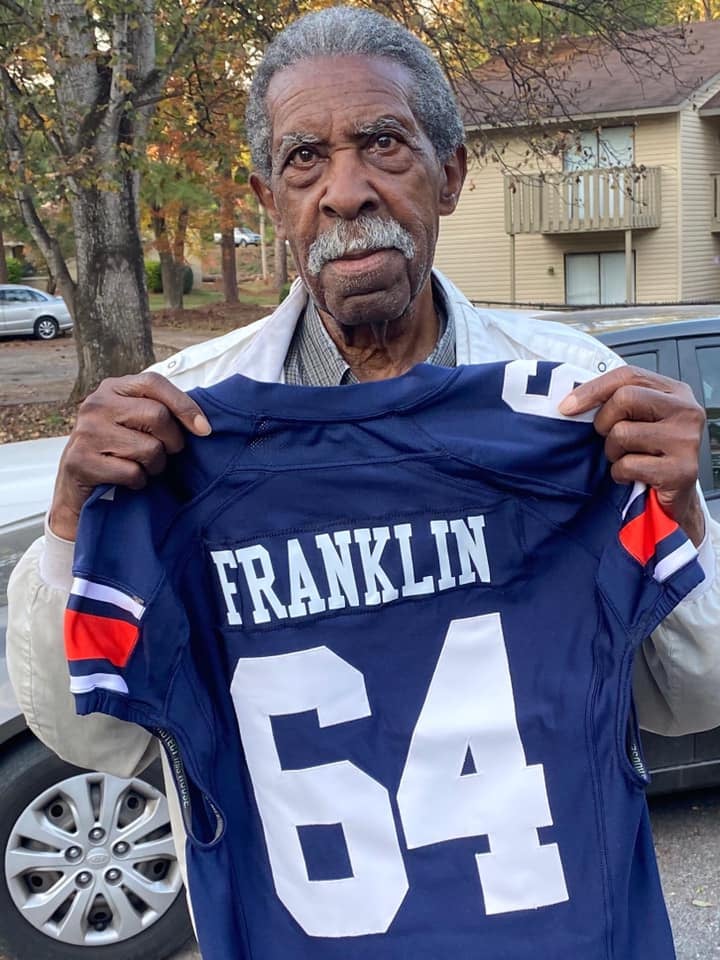 Travis Williams surprises Dr. Harold Franklin with Auburn jersey