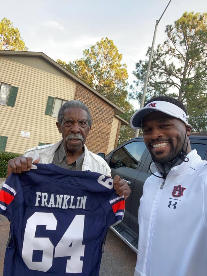 Travis Williams surprises Dr. Harold Franklin with Auburn jersey