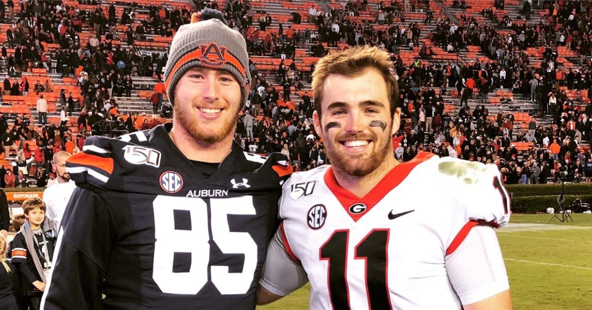 Photo: Jake Fromm with brother Tyler on field after Auburn game