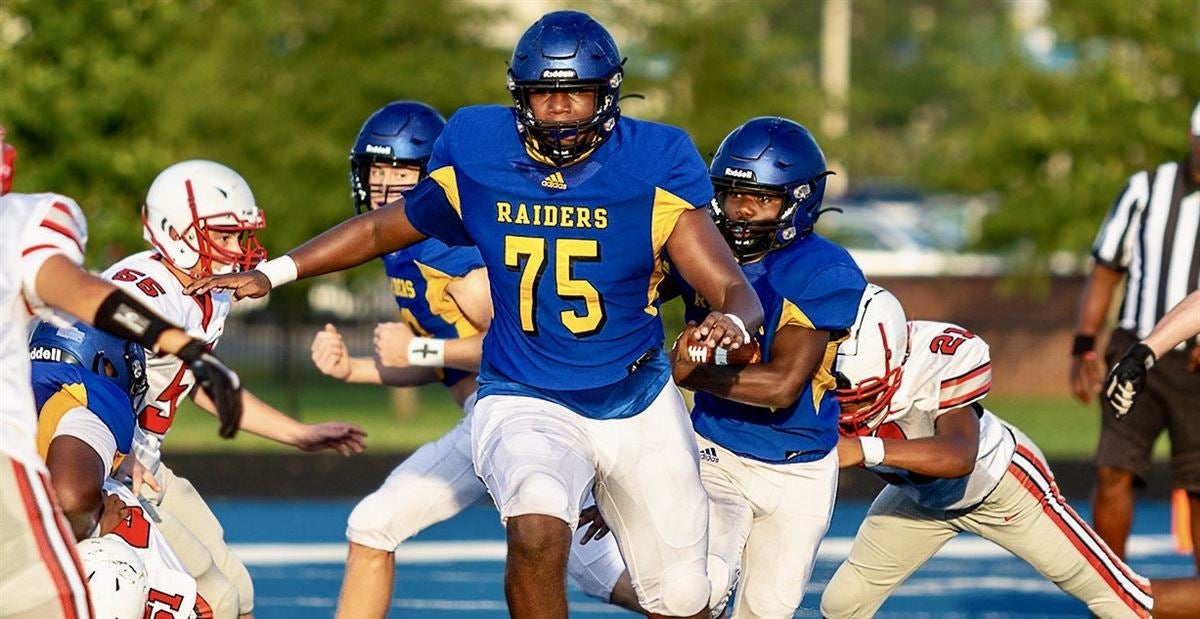 Warren East OL Jari Barber checks out Louisville