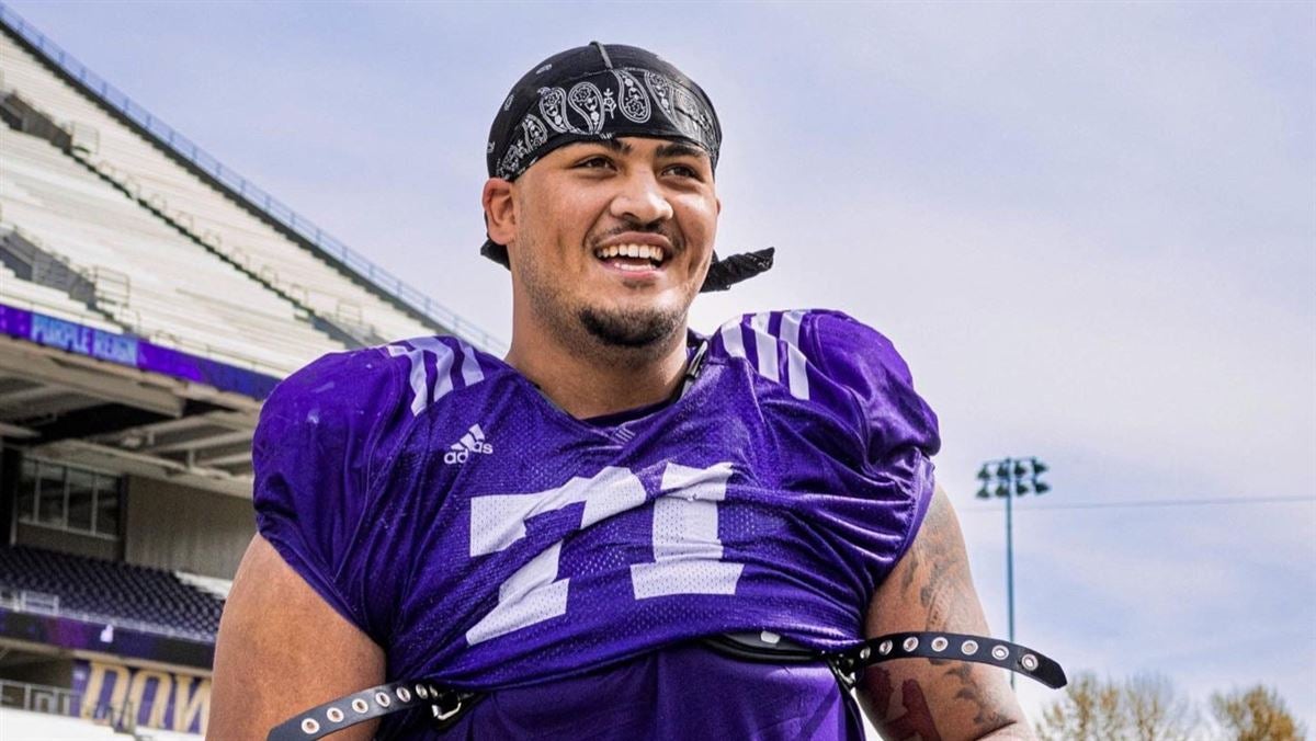 Washington offensive lineman Nate Kalepo makes the call to Ole Miss